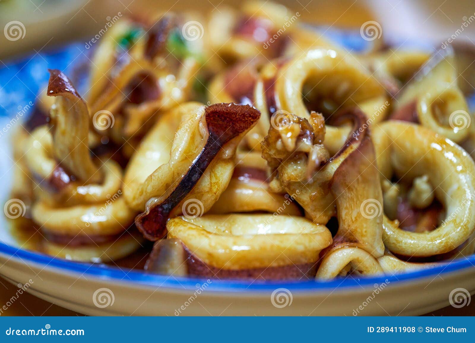 A Delicious Chinese Dish with Fried Fresh Squid in Sauce Stock Photo ...