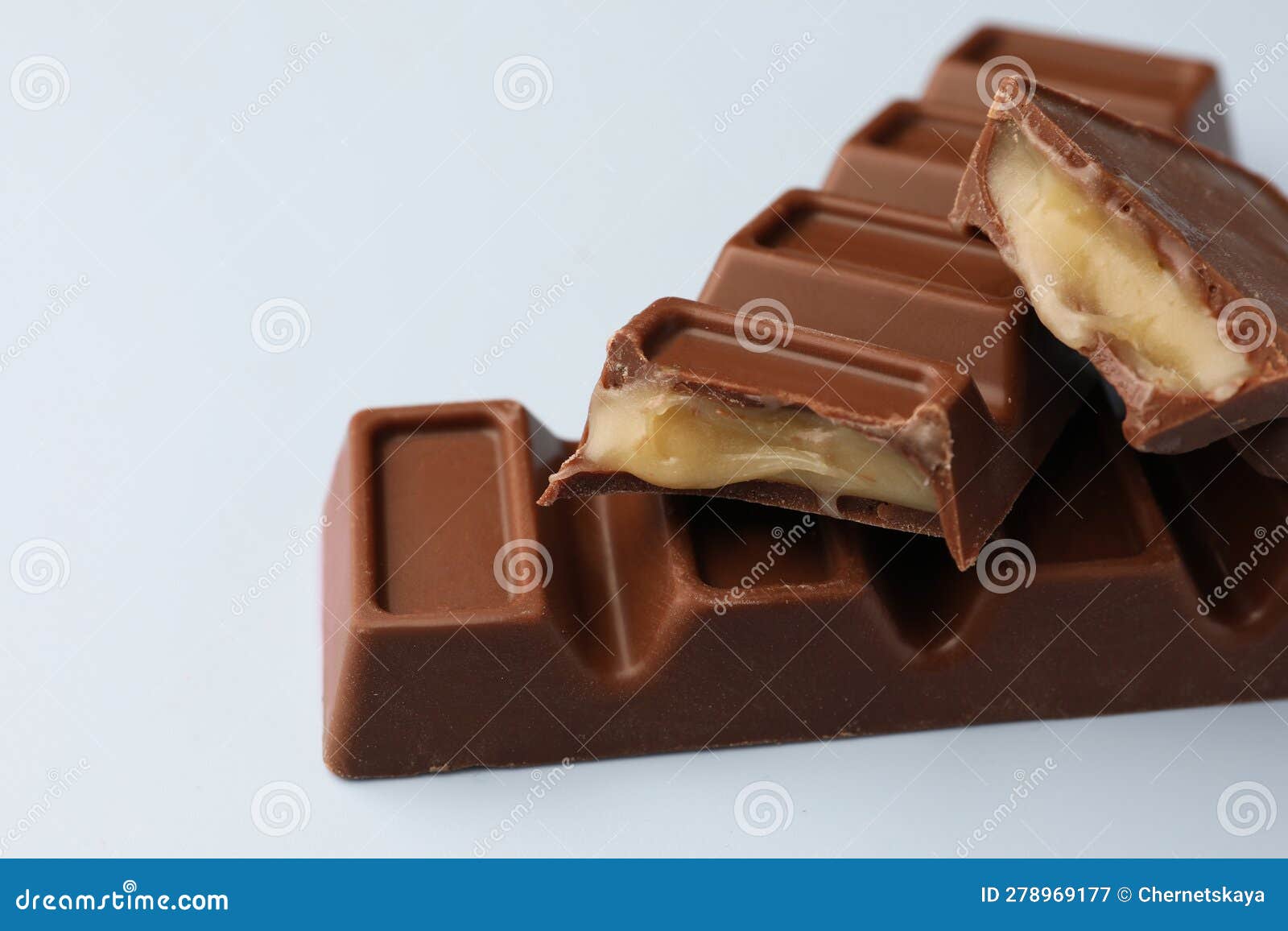 Delicious Chocolate Bars on Light Blue Background, Closeup Stock Image ...