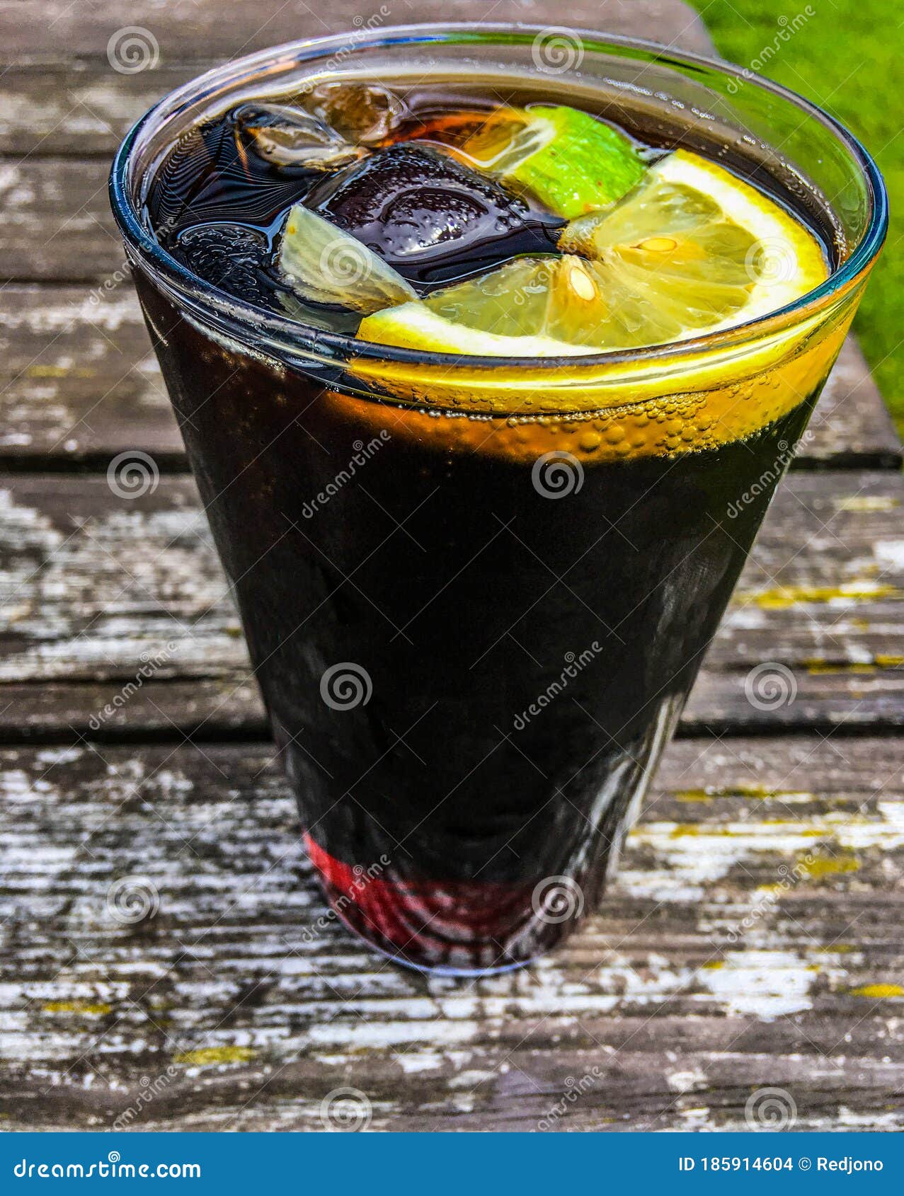 Delicious Cold Refreshing Cola with Ice and Slice of Lemon in a Glass ...