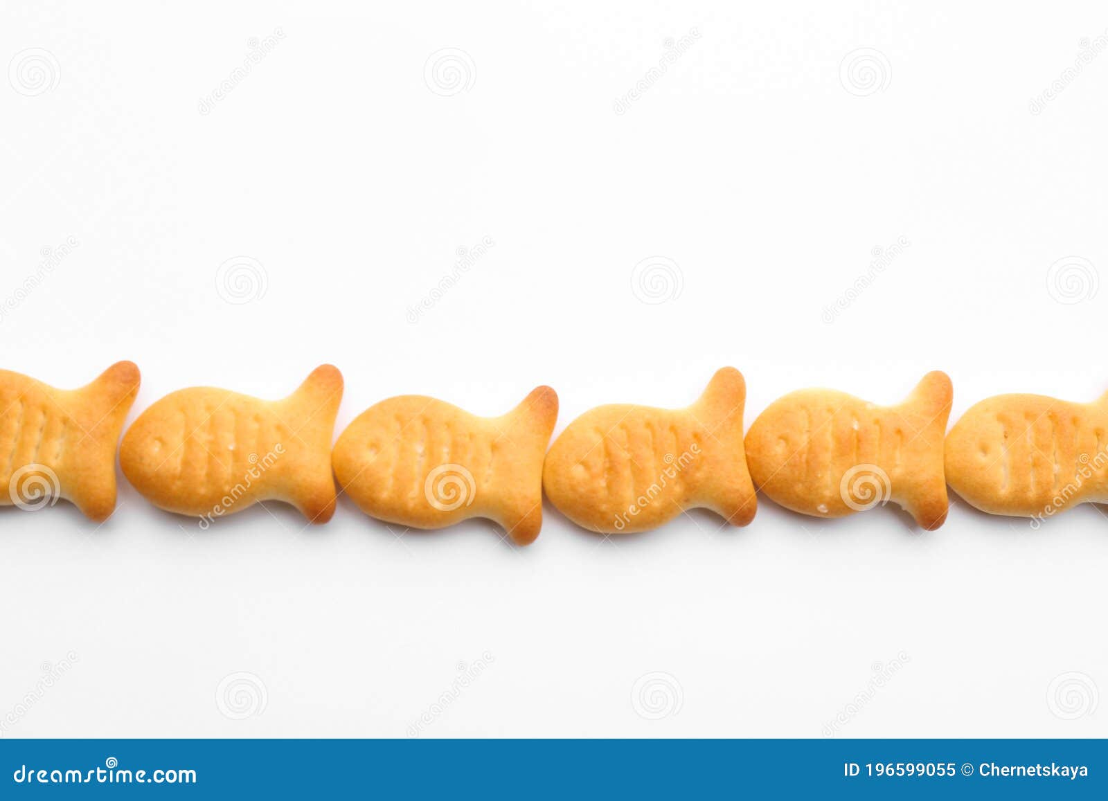 Delicious Crispy Goldfish Crackers on White Background, Top View Stock ...