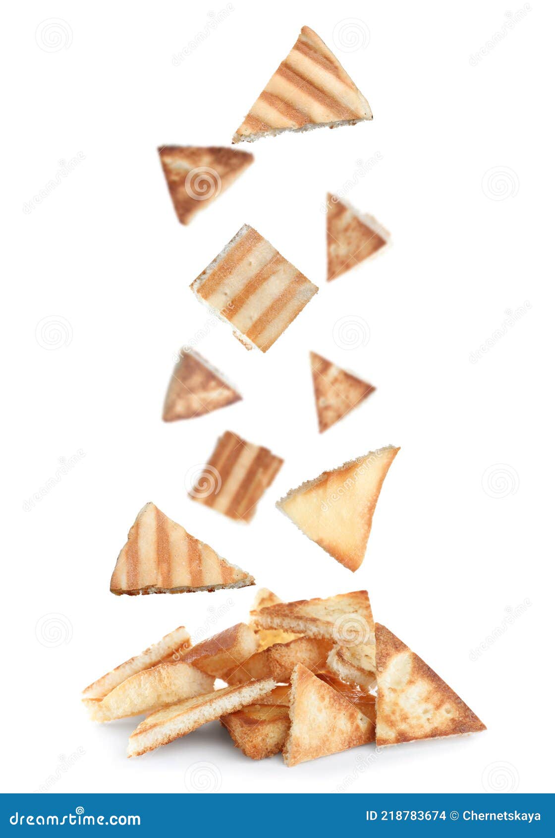 Delicious Crispy Pita Chips Falling into Heap on White Background Stock ...