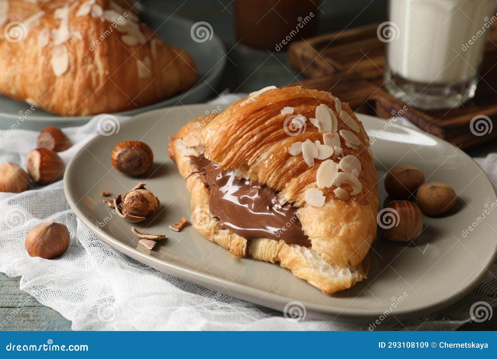 Delicious Croissant with Chocolate and Nuts on Table, Closeup Stock ...