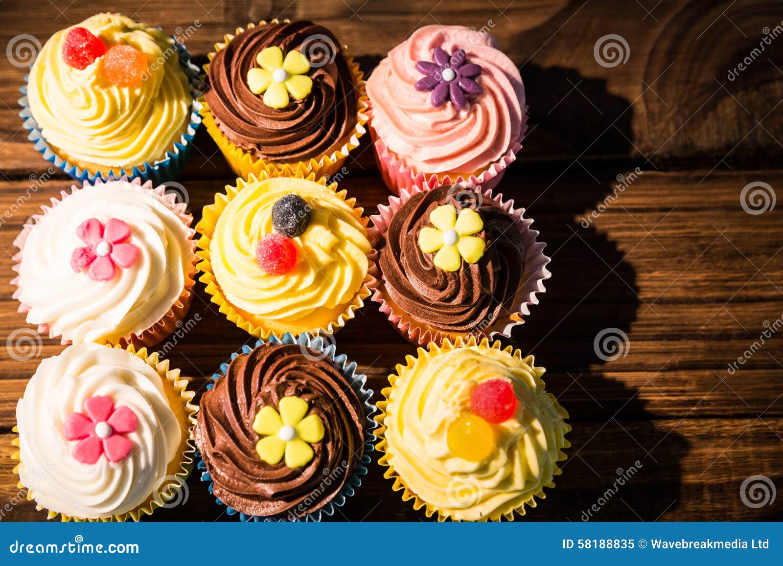 Delicious Cupcakes on a Table Stock Image - Image of wood, food: 58188835