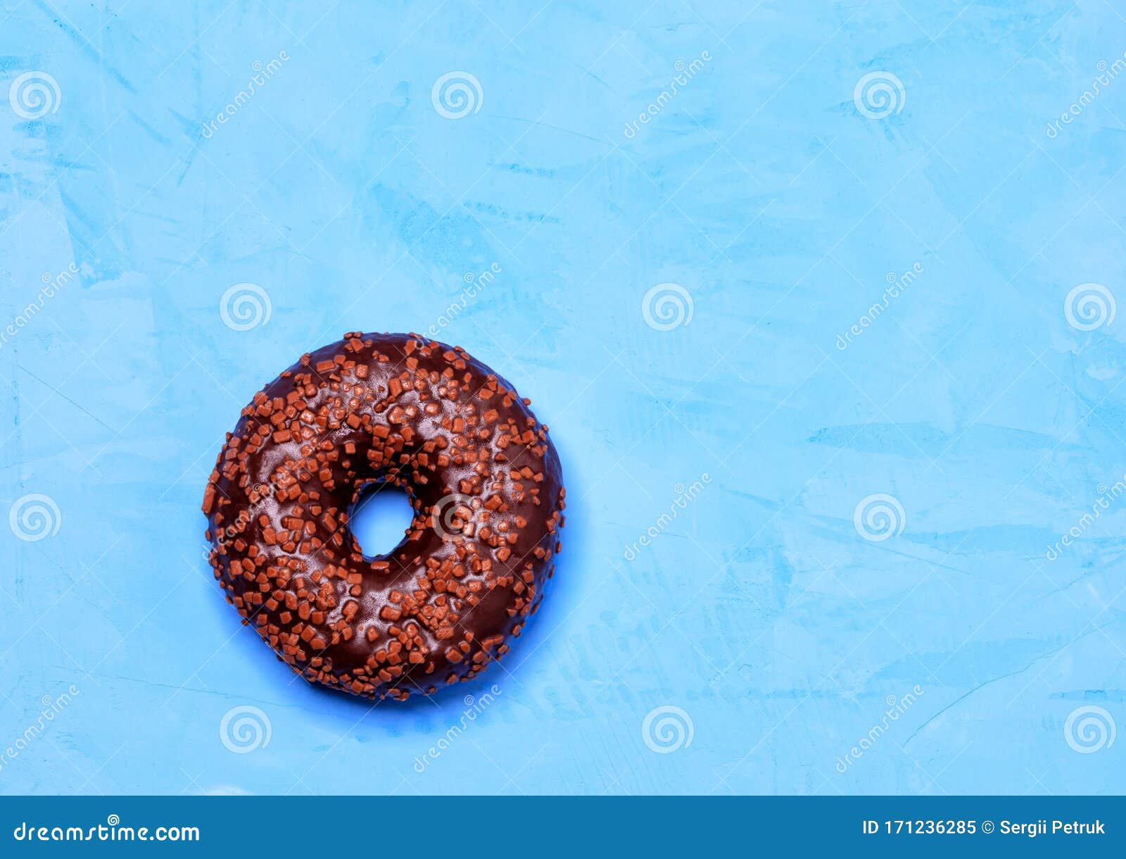 Delicious Chocolate Donut on a Blue Concrete Surface in Cold Light ...