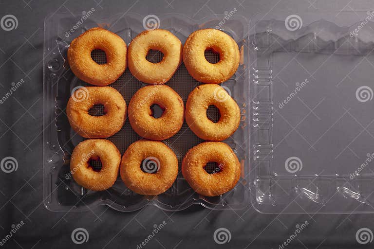 Delicious Donuts in a Plastic Container Stock Photo - Image of fried ...