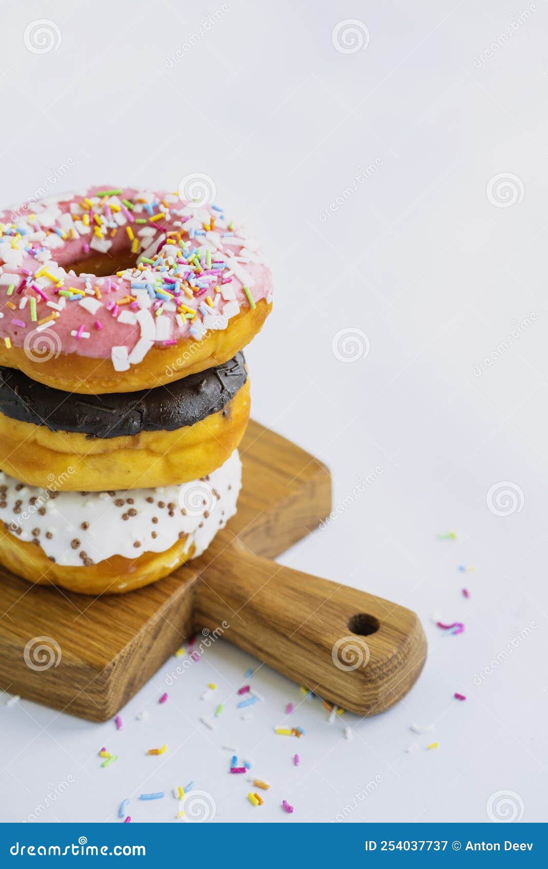 Delicious Donuts on Wooden Board, Placed on Wooden Cutting Board on ...