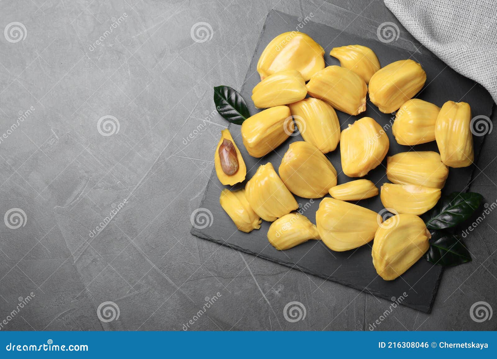 Delicious Exotic Jackfruit Bulbs on Grey Table, Top View. Space for ...