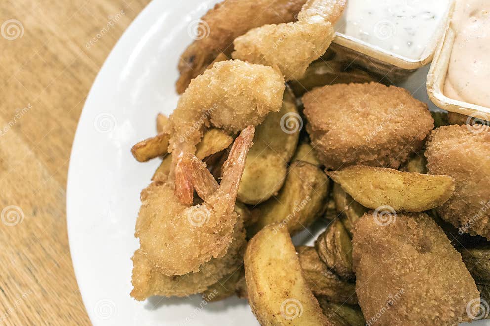 Delicious Fish Nuggets, Crispy Garlic Prawns, and Potato Wedges with ... Delicious Fish Nuggets, Crispy Garlic Prawns, and Potato Wedges with ...