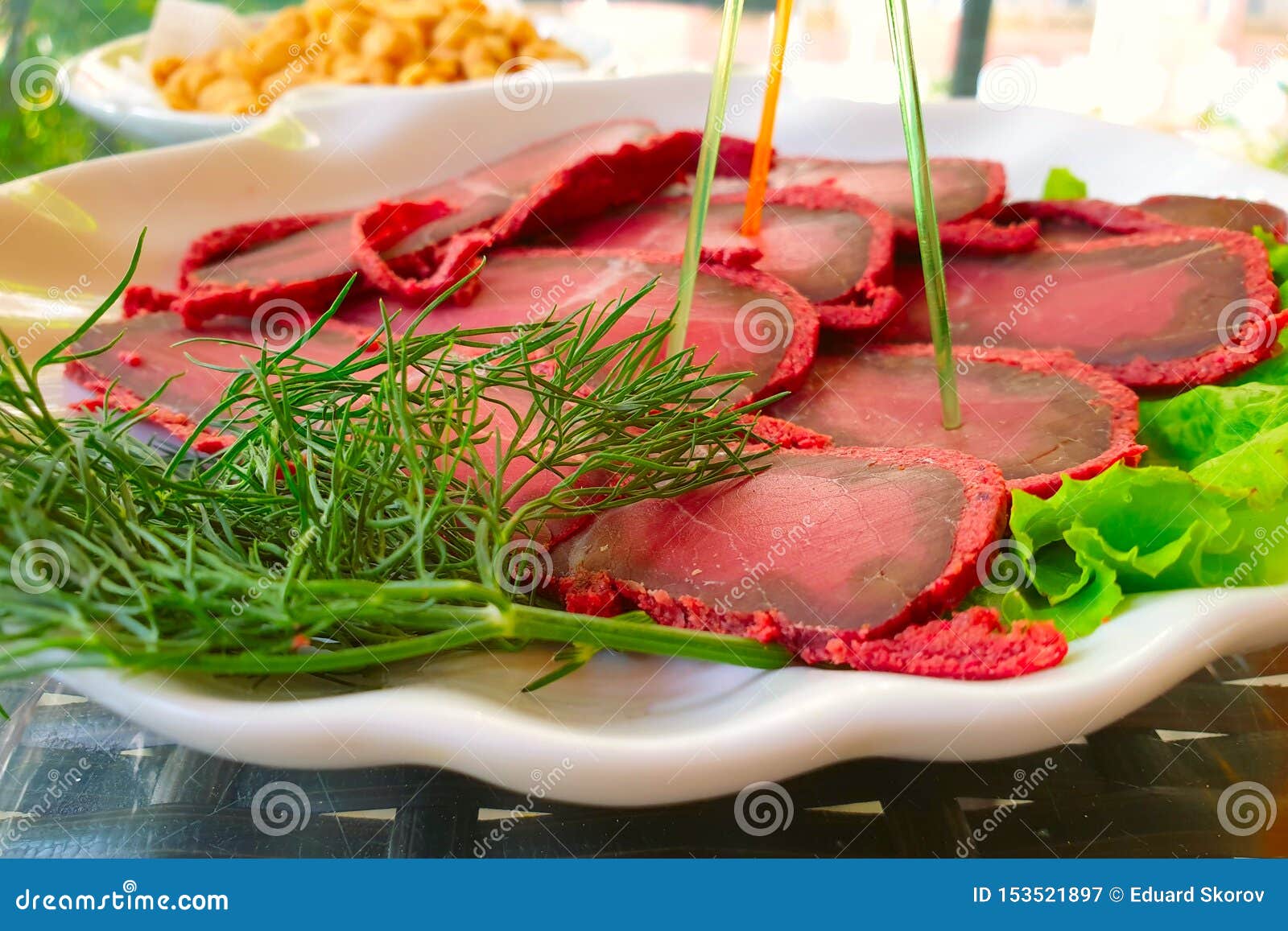 Delicious Fresh Basturma on a Plate with Lettuce. Table in the Summer ...