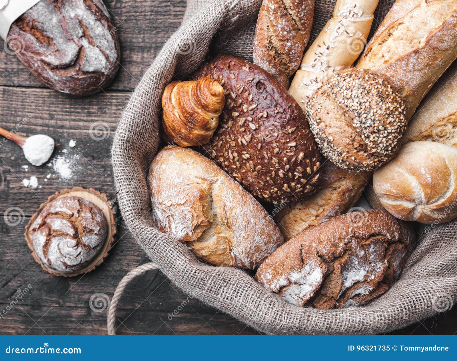 Delicious Fresh Bread Inside a Sack on Wooden Background Stock Image ...