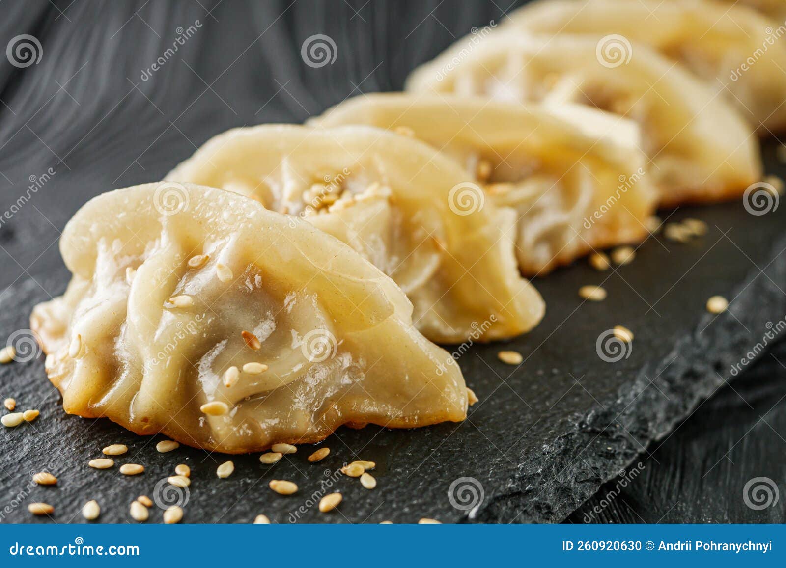 Delicious Fried Gyoza Dumplings on a Black Plate Stock Photo - Image of ...