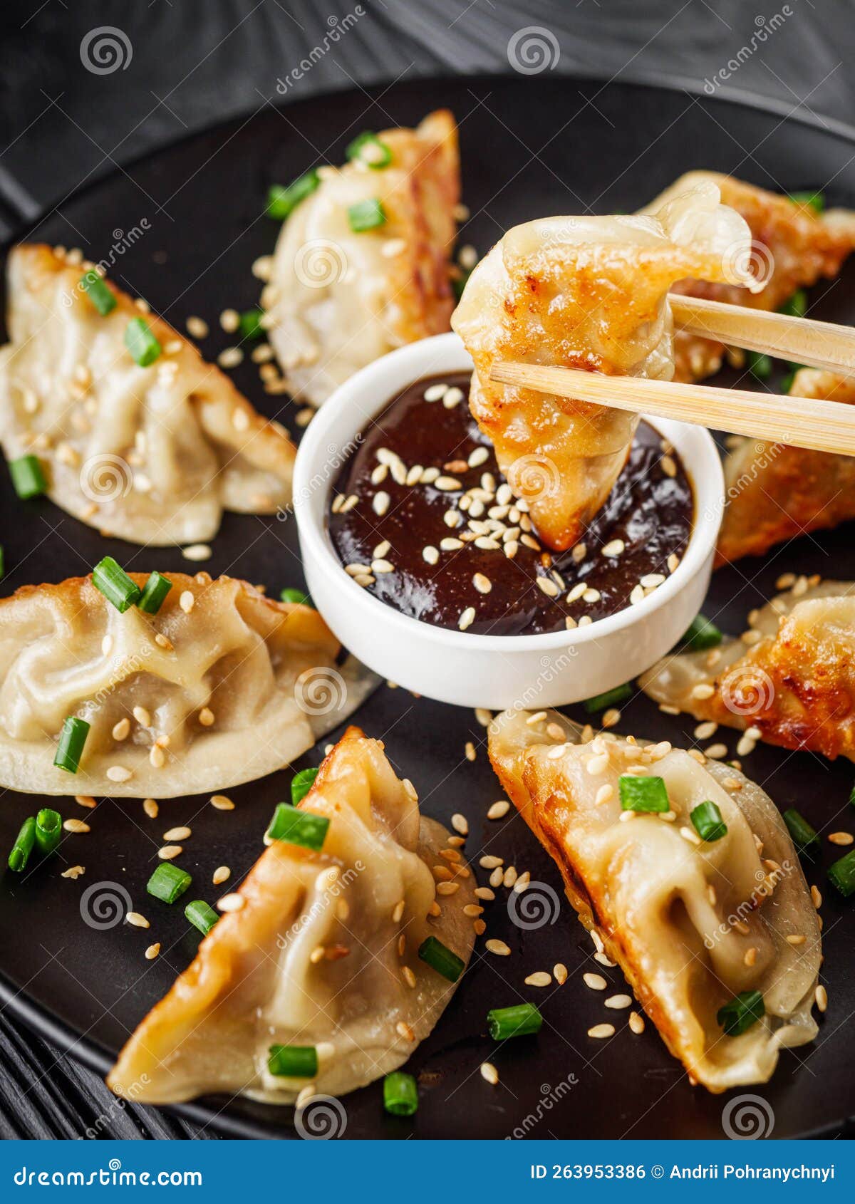 Delicious Fried Gyoza Dumplings on a Black Plate Stock Photo - Image of ...