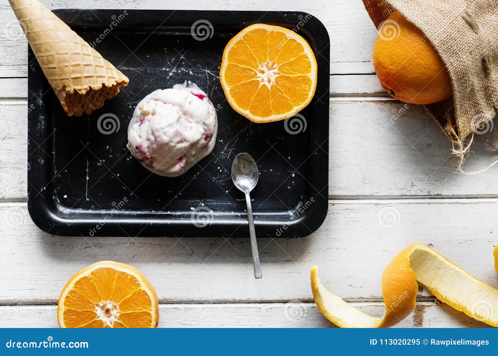 Delicious Frozen Ice Cream with Silver Spoon and Oranges on the Table ...