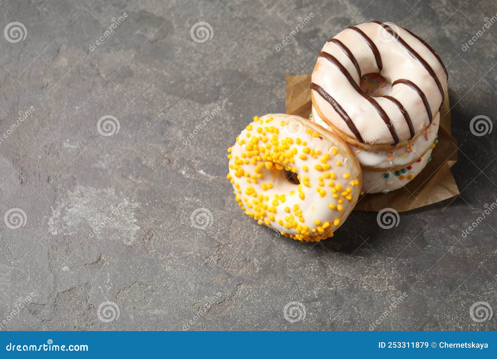 Delicious Glazed Donuts on Grey Table. Space for Text Stock Image ...