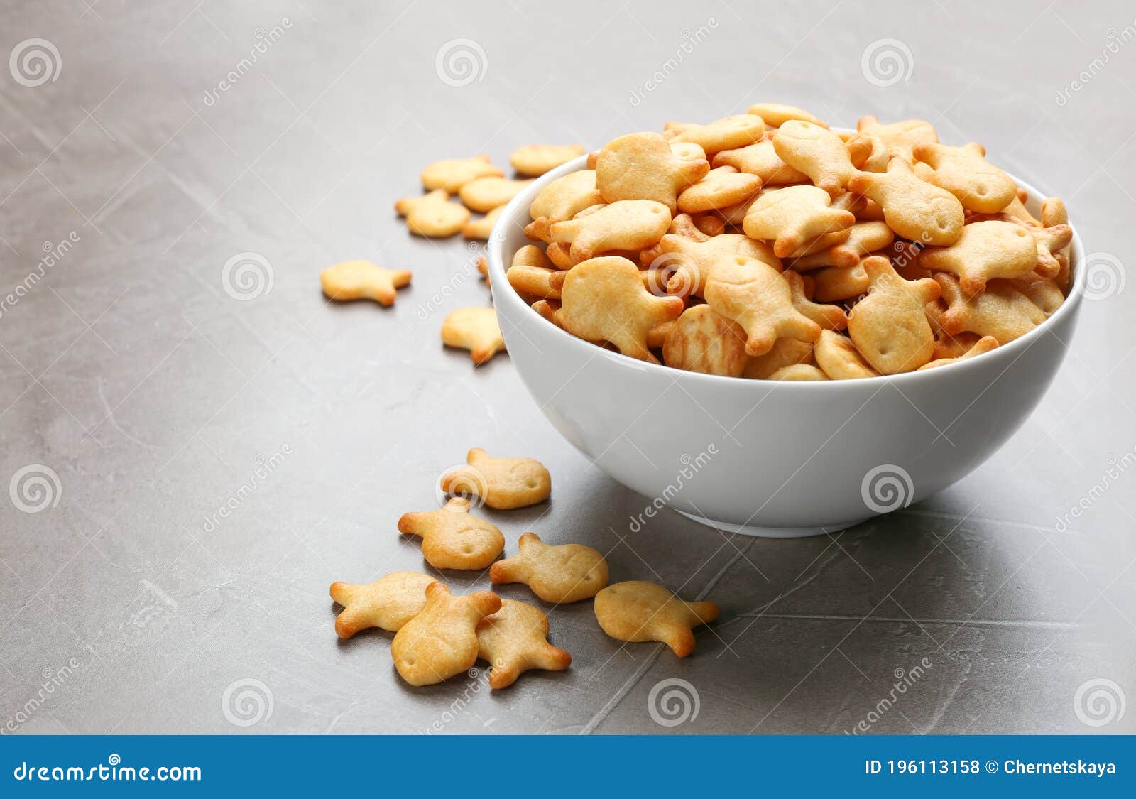 Delicious Goldfish Crackers in Bowl on Grey Table Stock Photo - Image ...