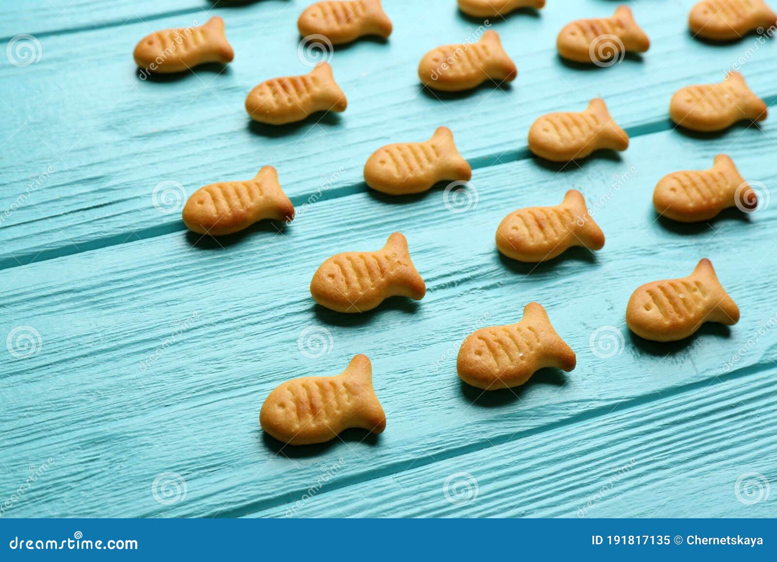 Delicious Goldfish Crackers on Blue Wooden Table, Closeup Stock Image ...