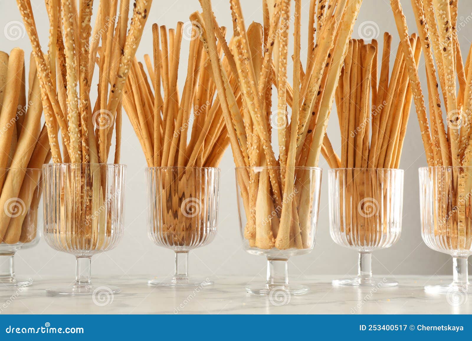 Delicious Grissini Sticks Served in Glasses on White Marble Table Stock ...