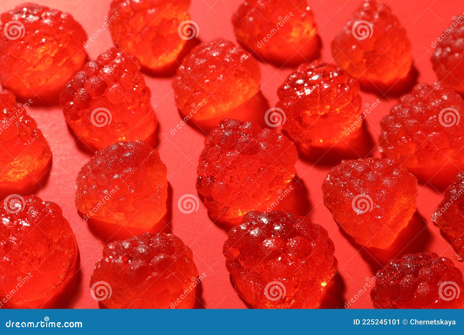 Delicious Gummy Raspberry Candies on Red Background, Closeup Stock ...