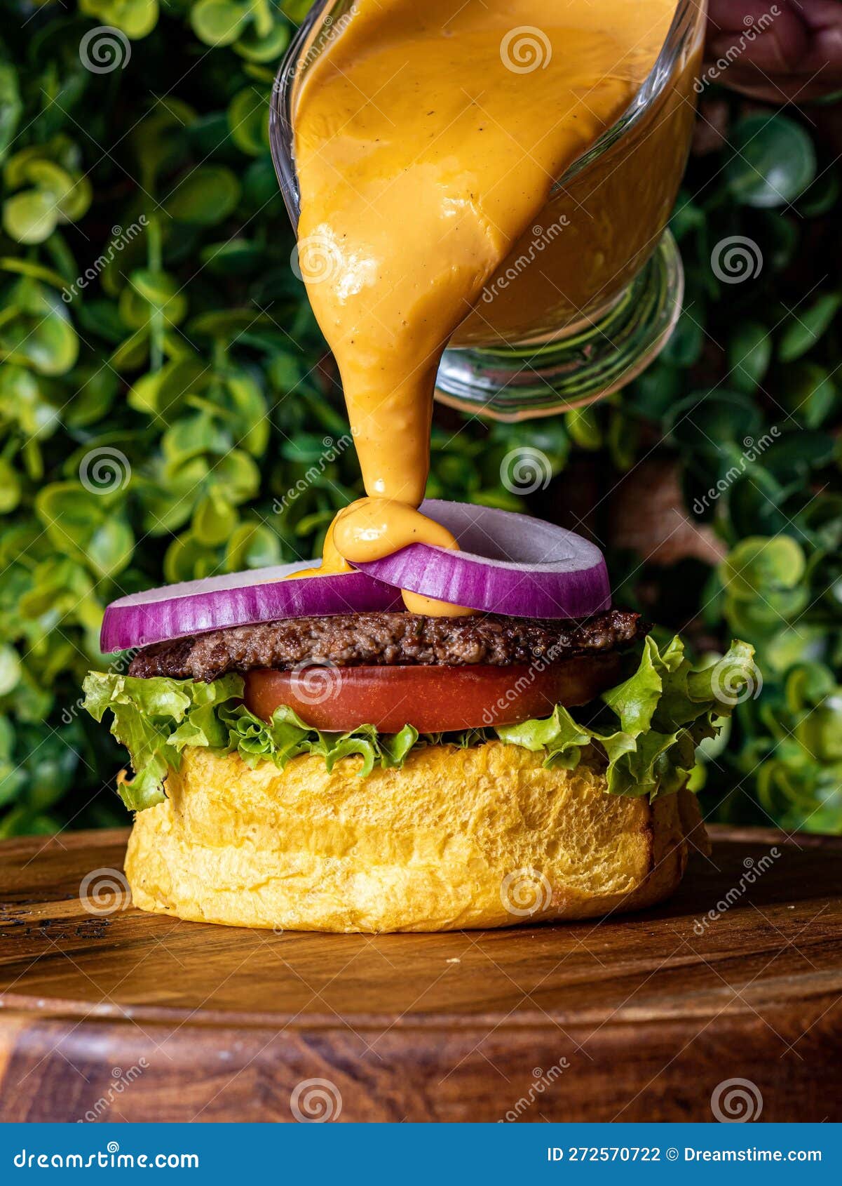 Delicious Hamburger and a Chef Adding Melted Cheese it Stock Photo ...