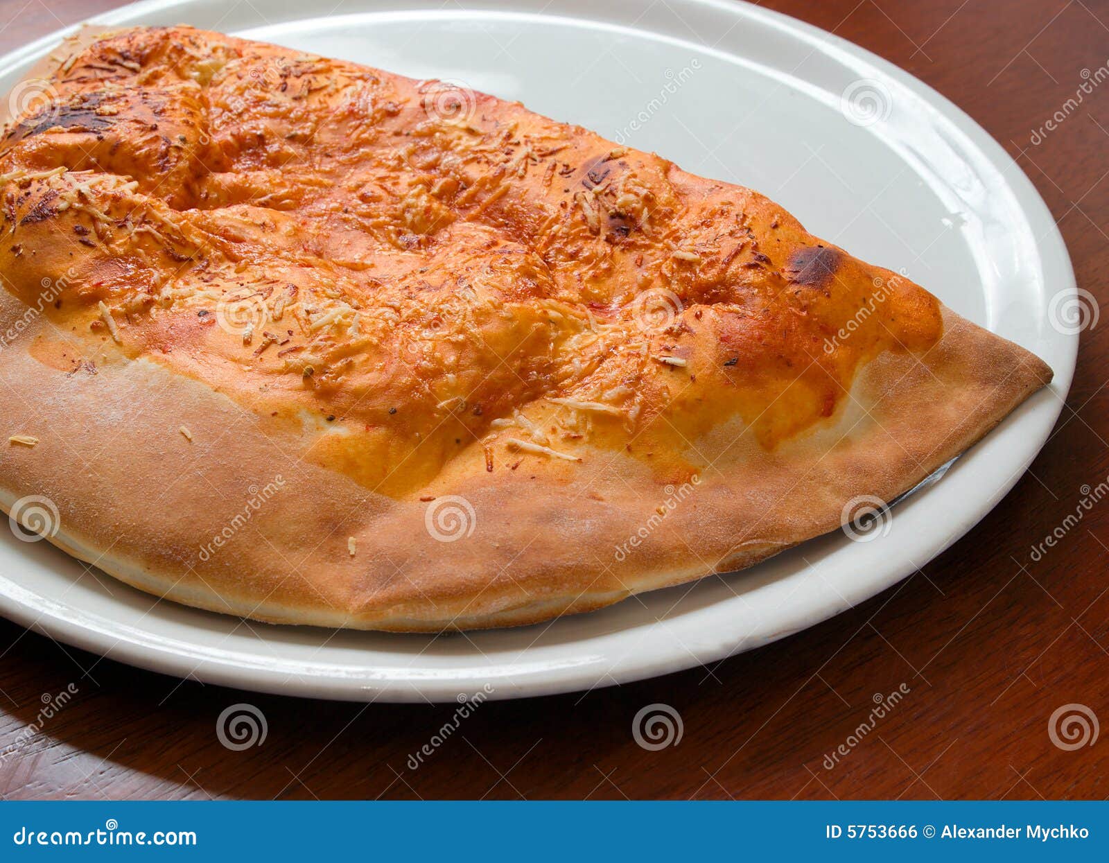 Delicious Hot Calzone Pizza on a Plate Stock Photo - Image of melted ...