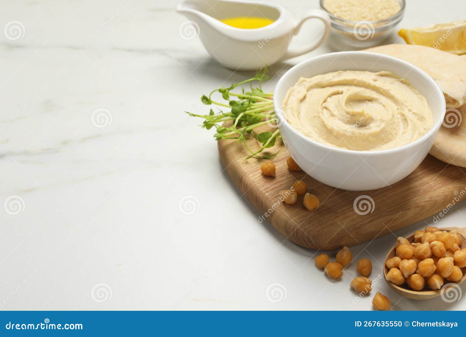 Delicious Hummus and Different Ingredients on White Marble Table. Space ...