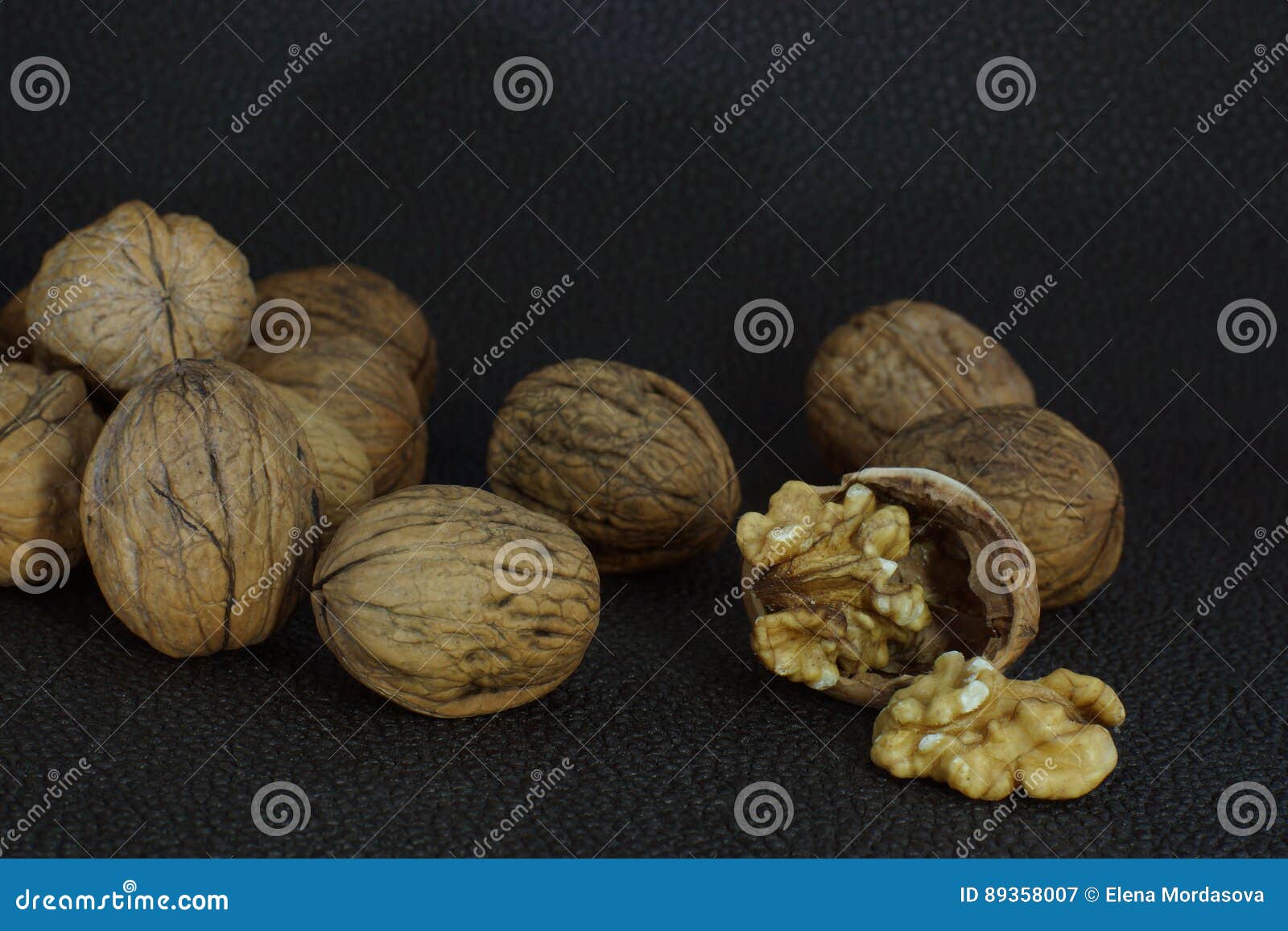Delicious Kernel of Walnut on a Chopped Shell. Around Whole Nuts Stock ...