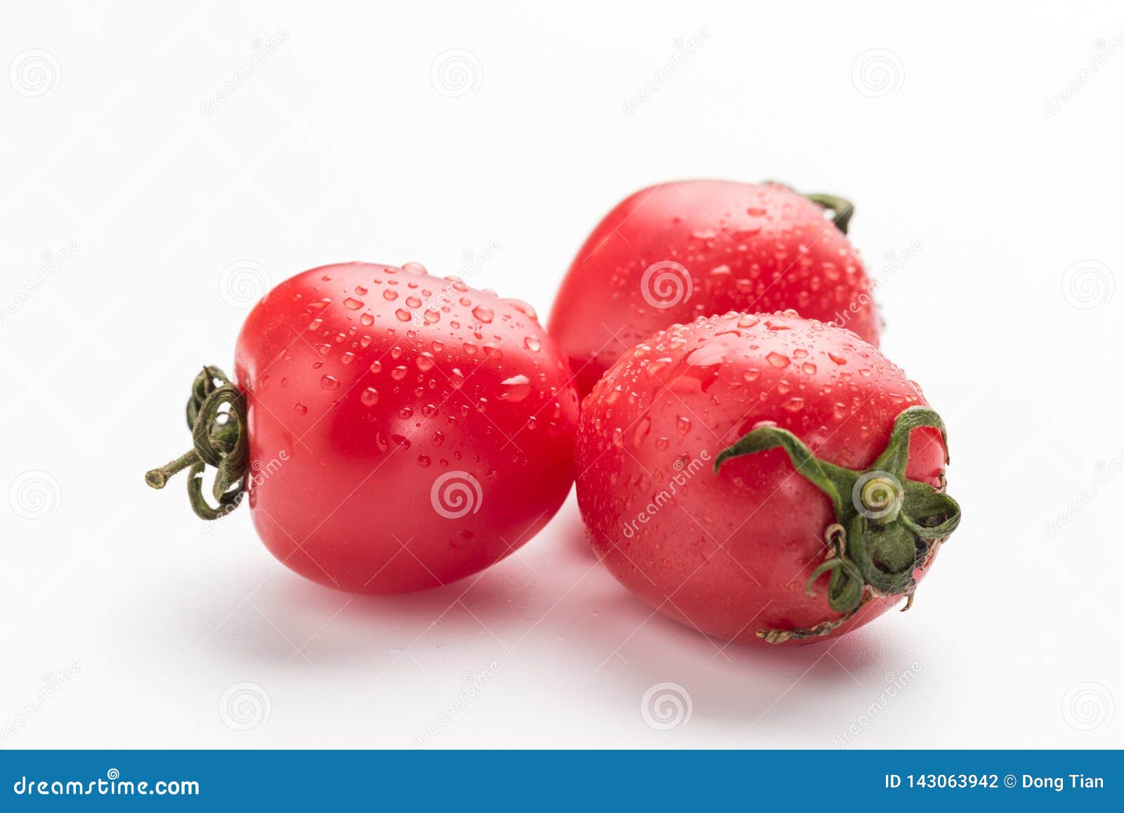 Delicious little tomatoes stock photo. Image of ripe - 143063942