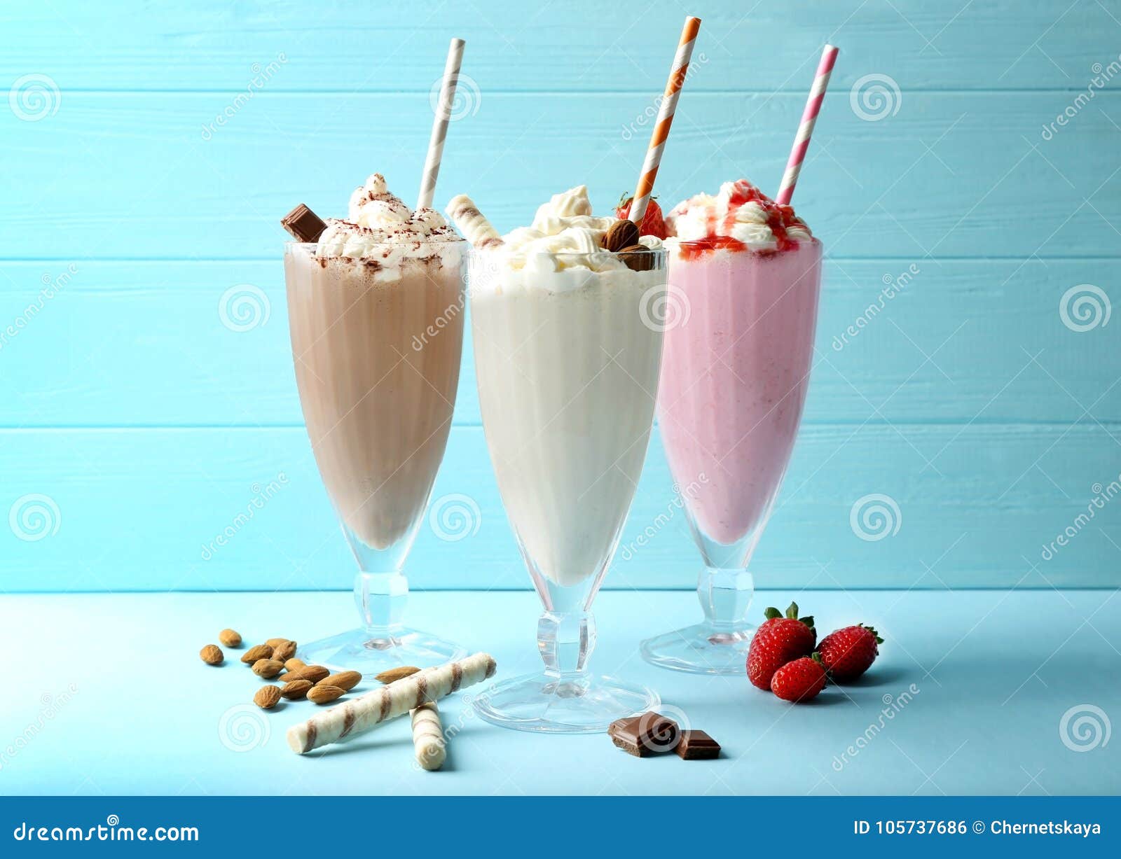 Delicious Milkshakes on Blue Background Stock Photo - Image of cookies ...