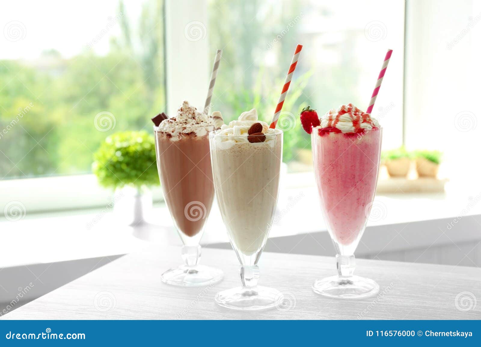 Delicious Milkshakes on Table Stock Photo - Image of table, refreshment ...