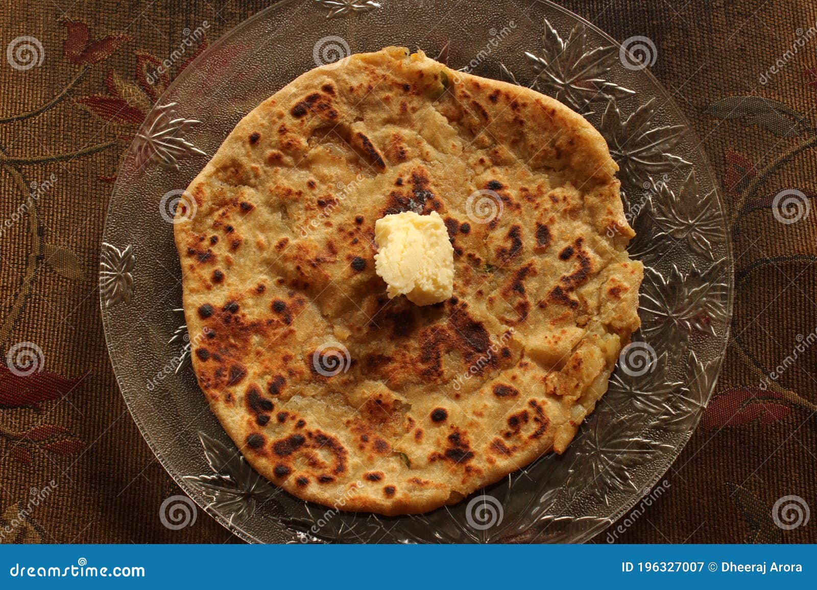 Delicious and Nutritious Alu Paratha with Pasteurized Butter Stock ...