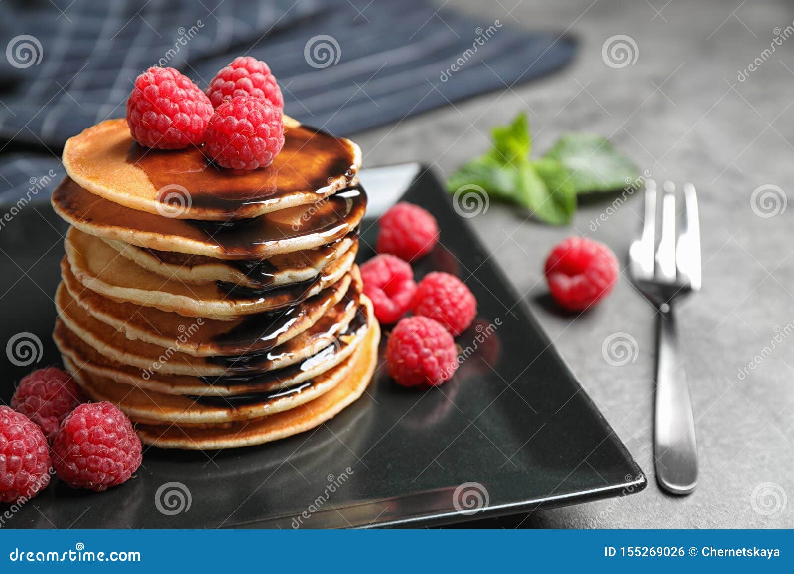 Delicious Pancakes with Fresh Raspberries and Chocolate Syrup Stock ...