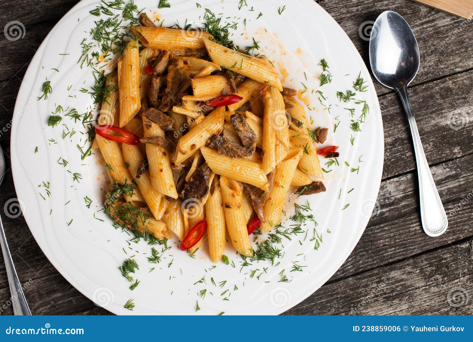Delicious Penne Pasta with Beef on Rustic Wood Stock Photo - Image of ...