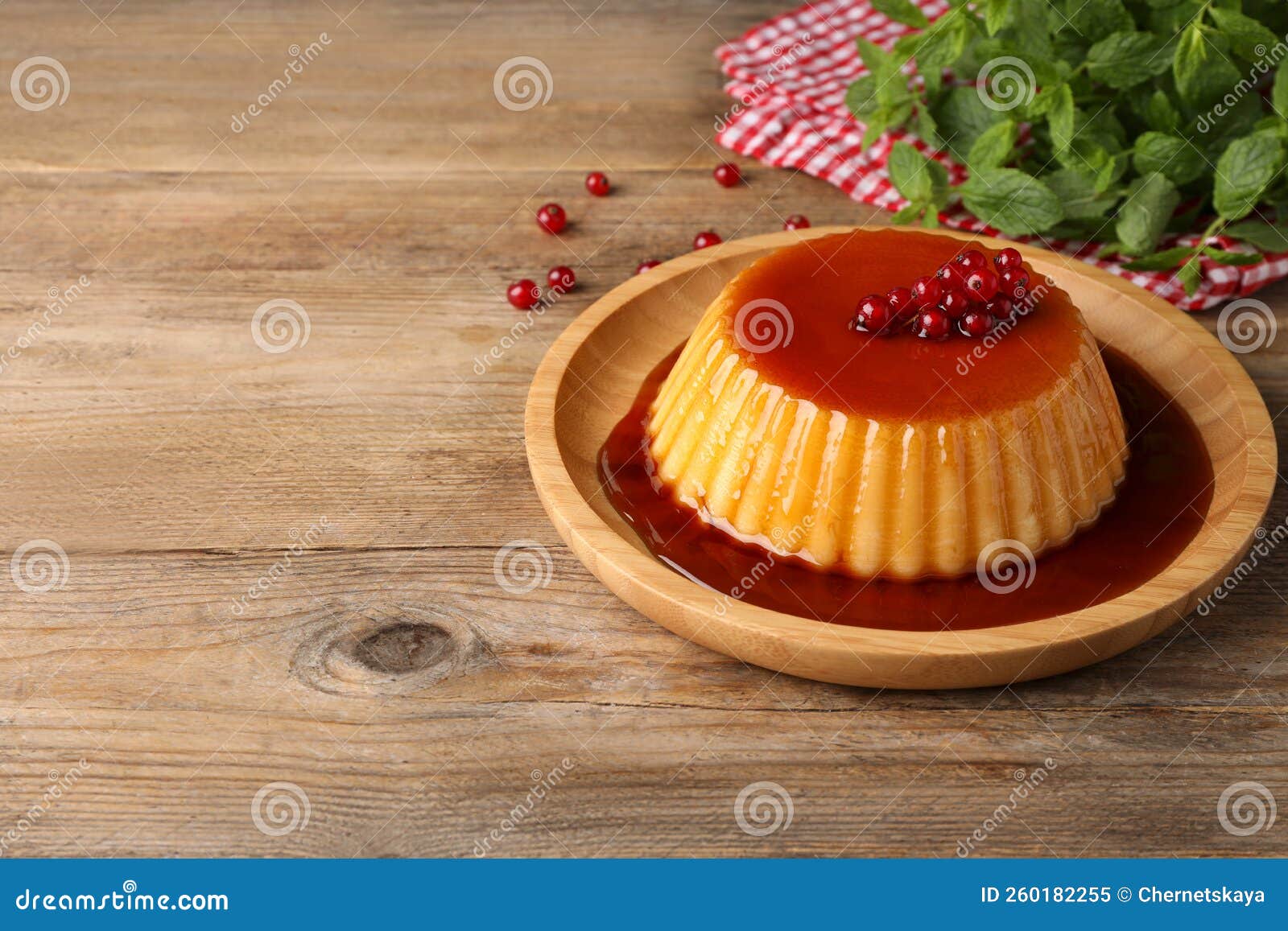 Delicious Pudding with Caramel and Redcurrants on Wooden Table. Space ...