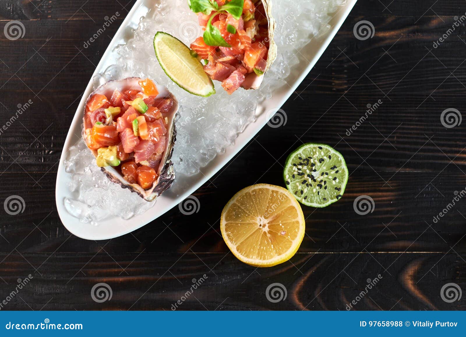 Delicious Red Fish in the Shells of Shellfish. with Lemon and Lime Jpg ...