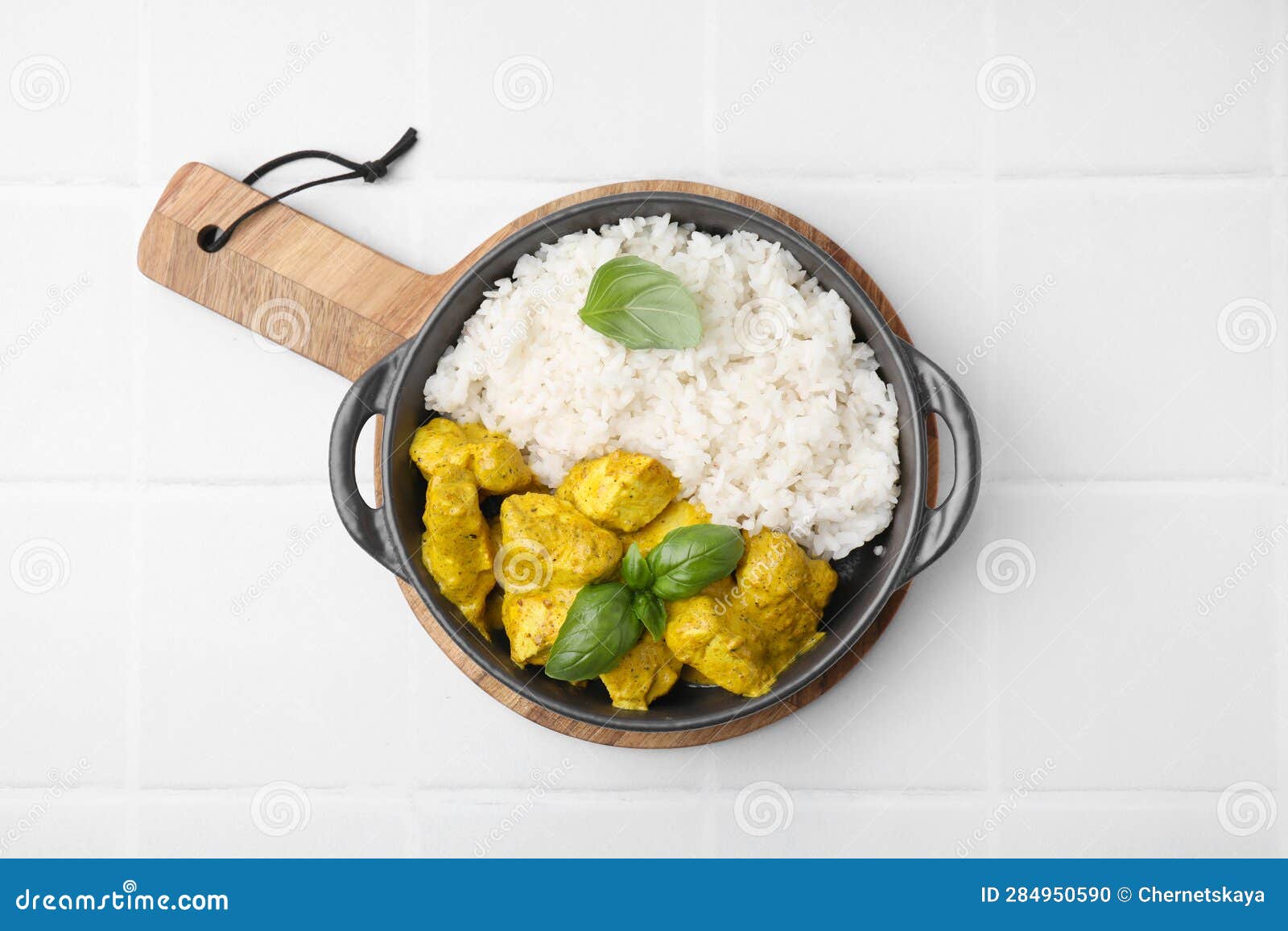 Delicious Rice and Chicken with Curry Sauce on White Tiled Table, Top ...