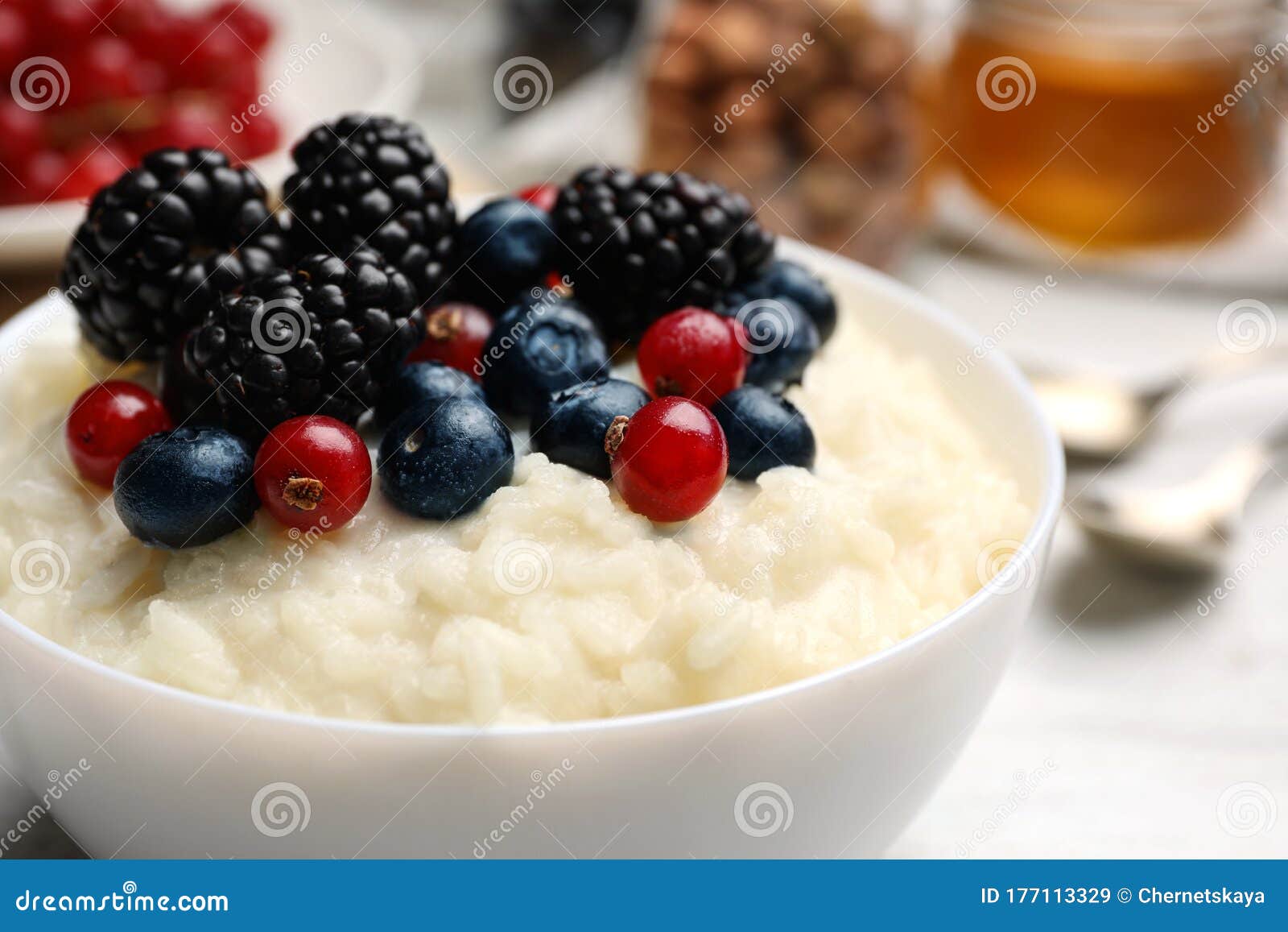Delicious Rice Pudding with Berries, Closeup Stock Image - Image of ...