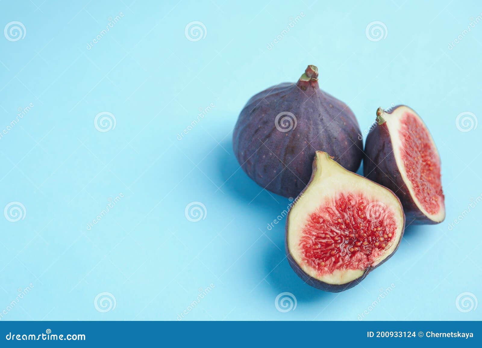 Delicious Ripe Figs on Light Blue Background, Closeup. Space for Text ...