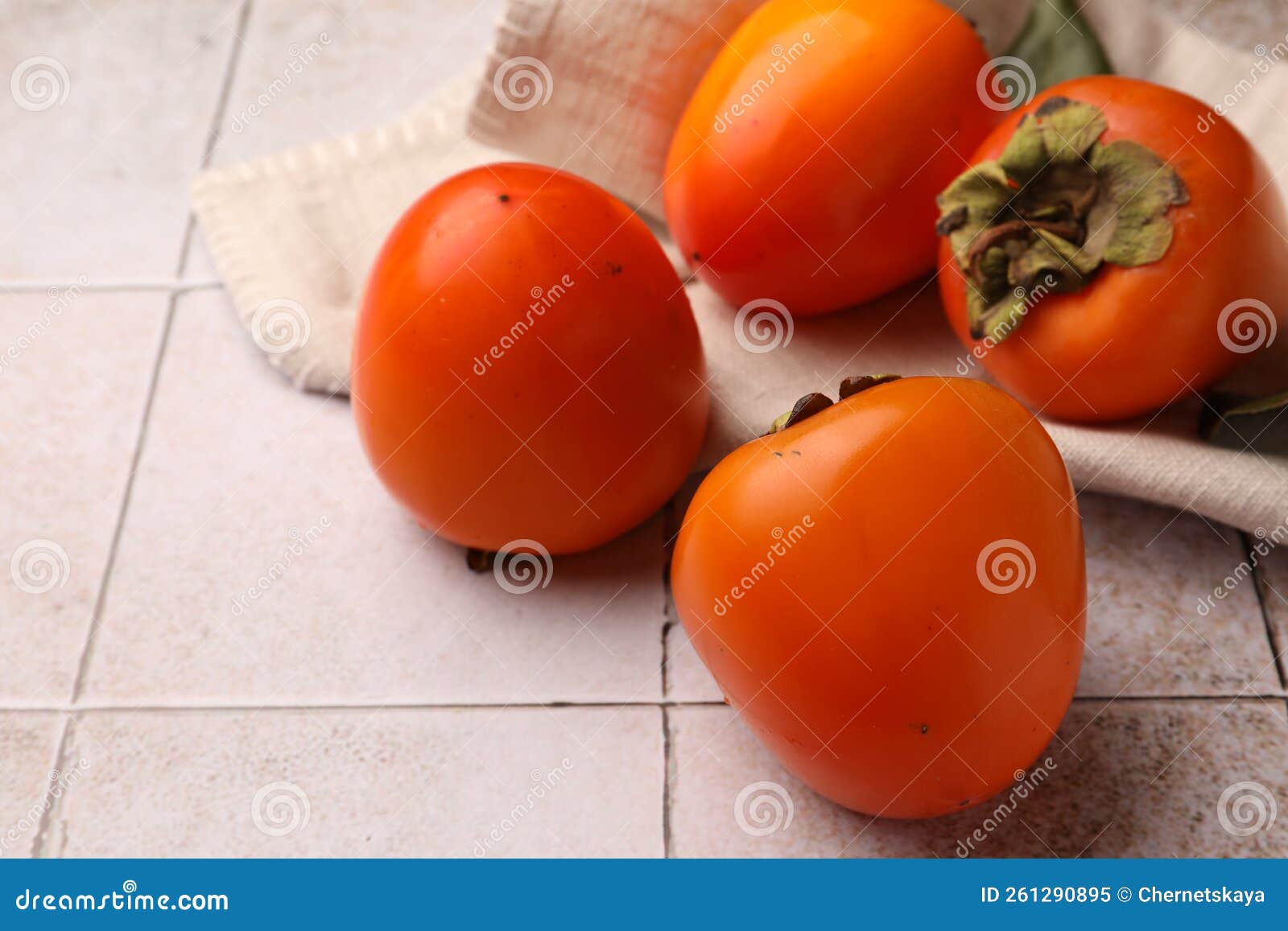 Delicious Ripe Juicy Persimmons on Tiled Surface, Space for Text Stock ...