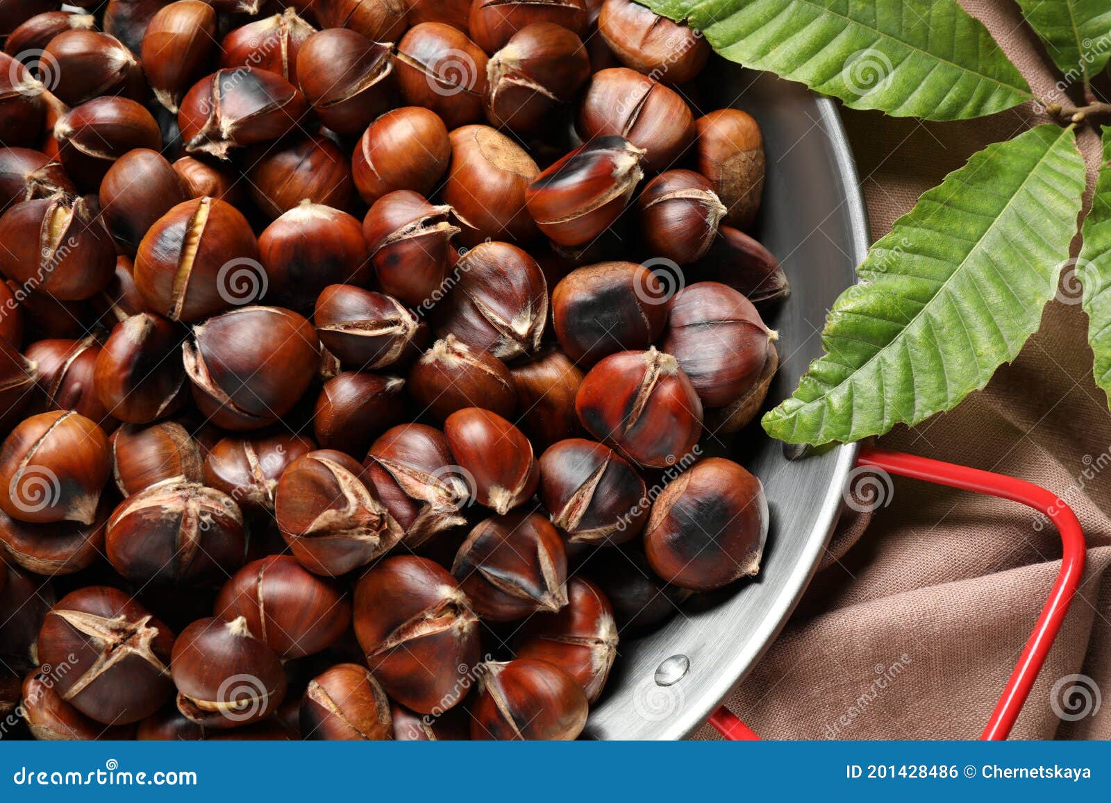 Delicious Roasted Edible Chestnuts in Frying Pan on Table, Top View ...