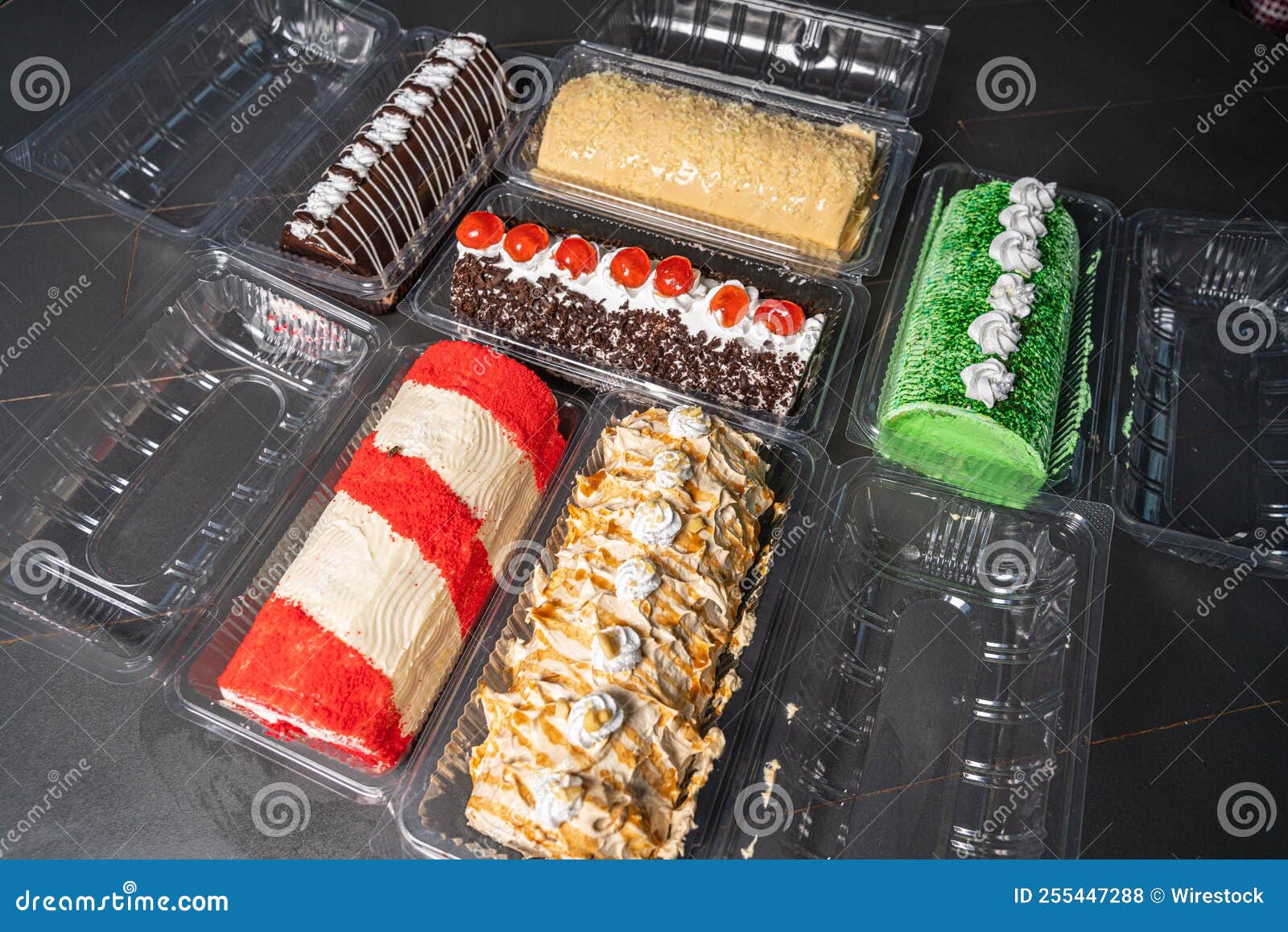 Delicious Roll Cakes in Plastic Containers Stock Photo - Image of ...