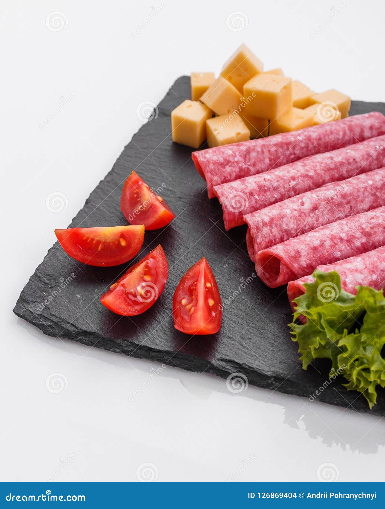 Delicious Sliced Salami on a Stone Plate White Background Stock Photo ...
