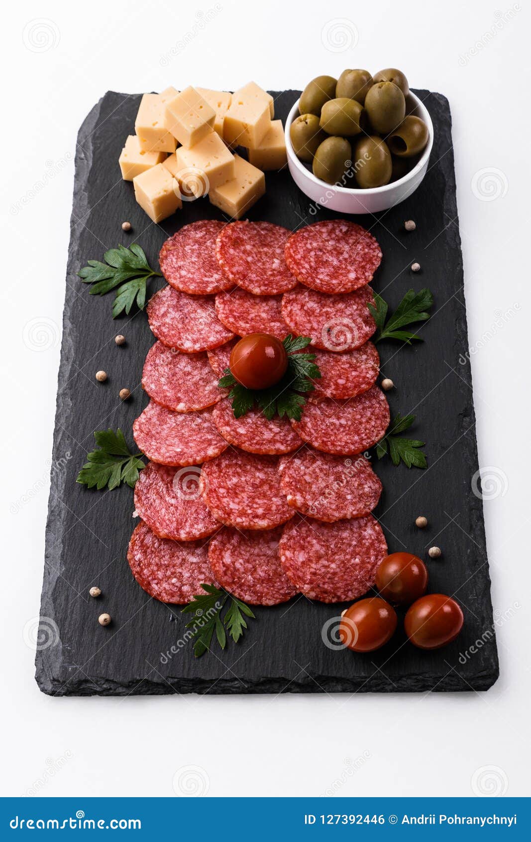Delicious Sliced Salami on a Stone Plate White Background Stock Photo ...