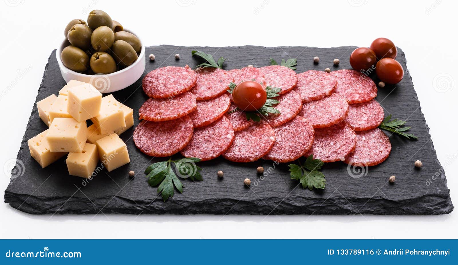 Delicious Sliced Salami on a Stone Plate White Background Stock Photo ...