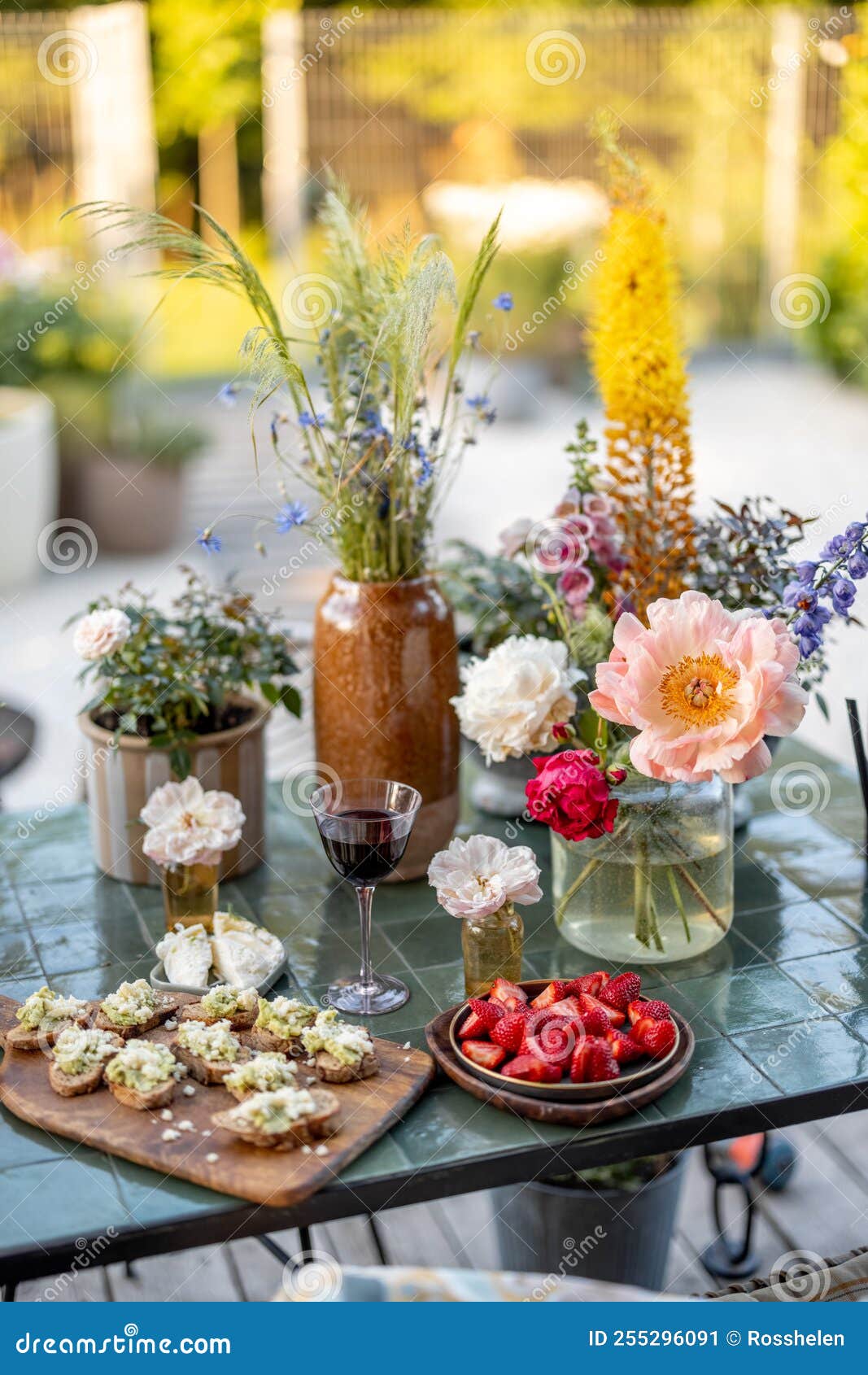 Delicious Snack on Garden Table Decorated with Flowers Stock Image ...