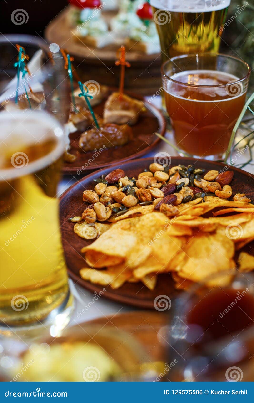 Delicious Snacks for Beer. Crispy Chips with Nuts Stock Photo - Image ...