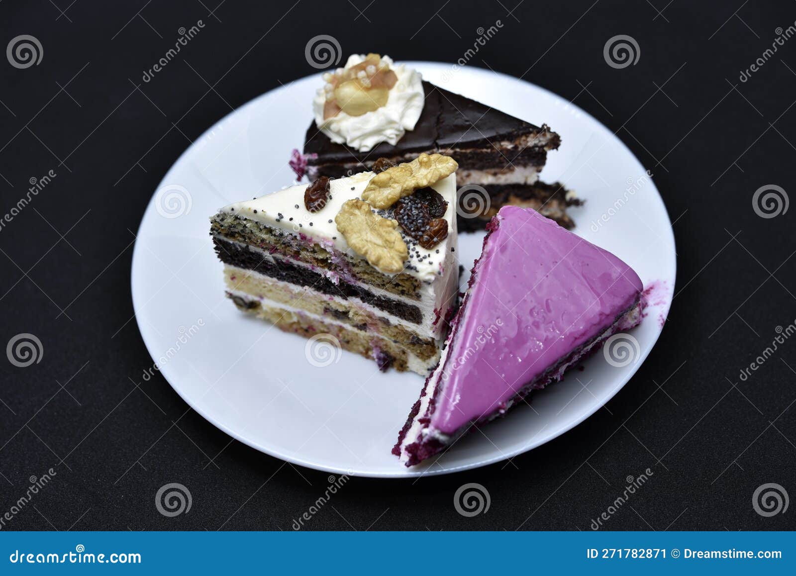 Delicious Sweet Cakes on a Plate. Sliced Cake with Nuts and Sweets ...