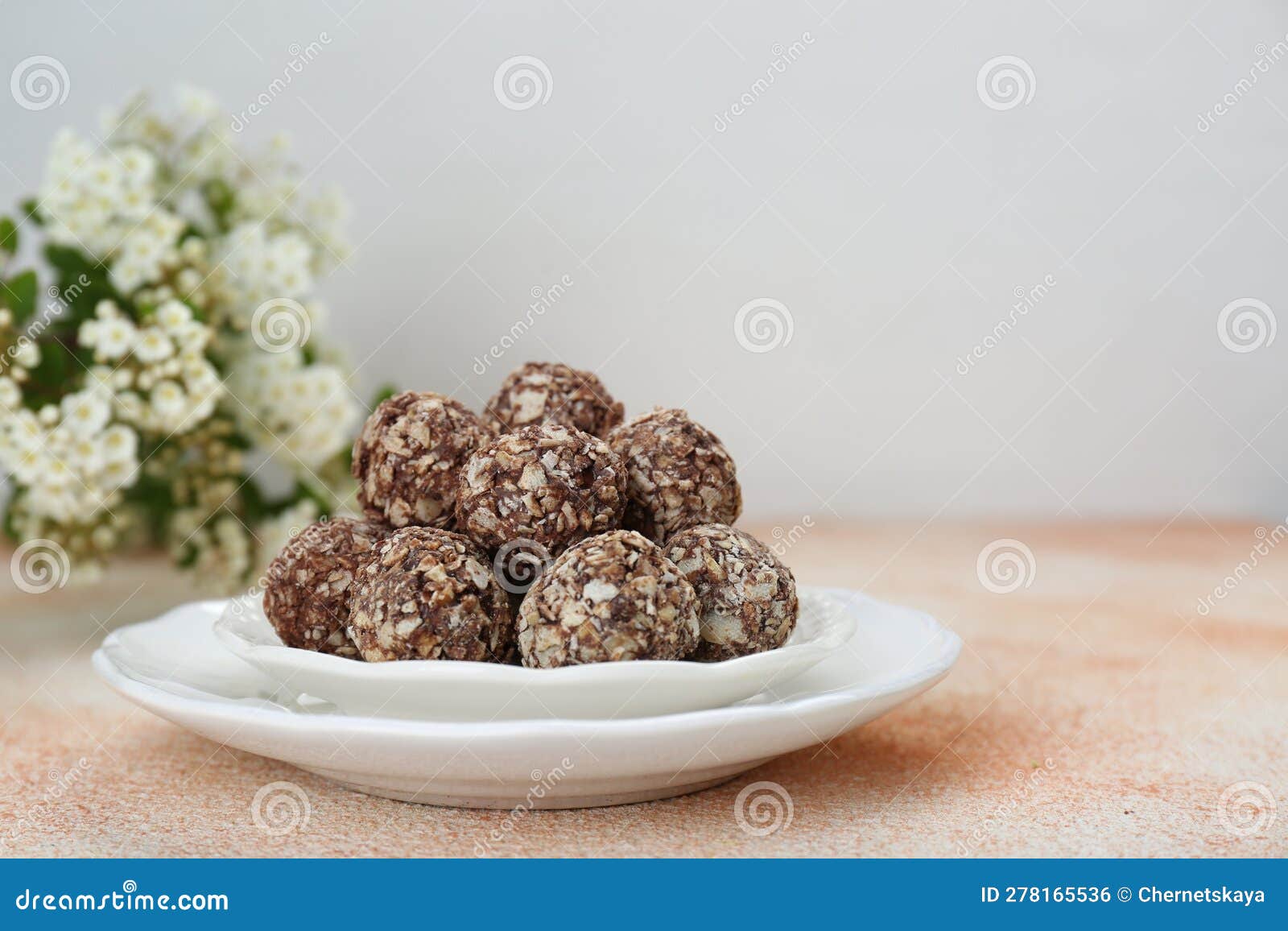 Delicious Sweet Chocolate Candies on Beige Table, Space for Text Stock ...