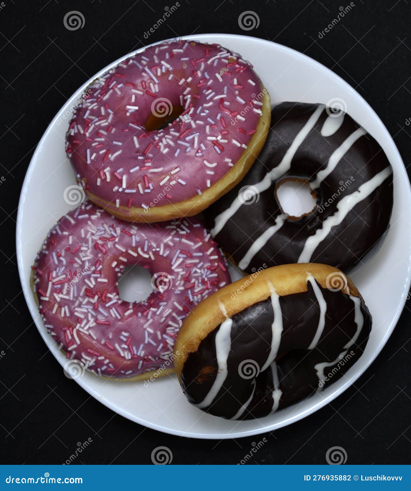 Delicious Sweet Donuts on a Plate. Glazed Doughnuts Stock Photo - Image ...