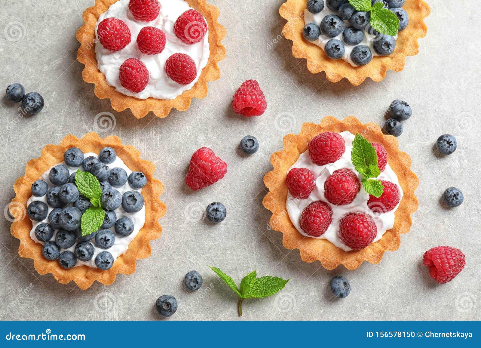 Delicious Sweet Pastries Berries on Grey Table, Flat Lay Stock Photo ...