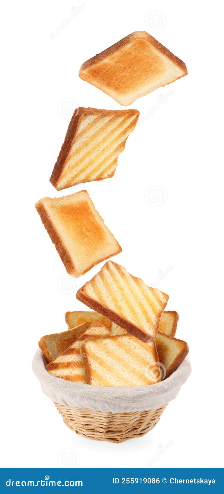 Delicious Toasted Bread Falling into Basket on White Background Stock ...